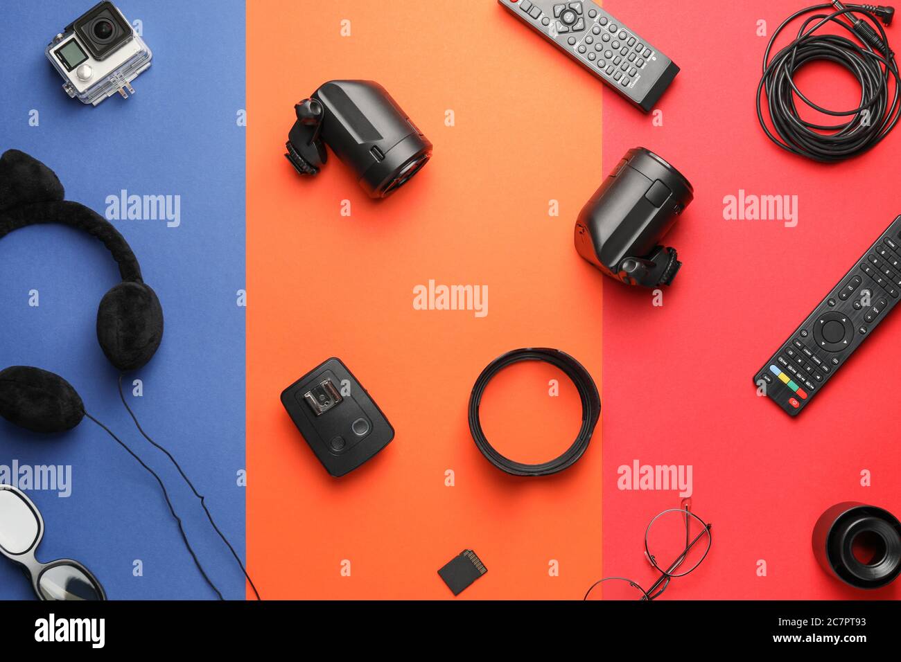 Different modern devices on color background Stock Photo - Alamy