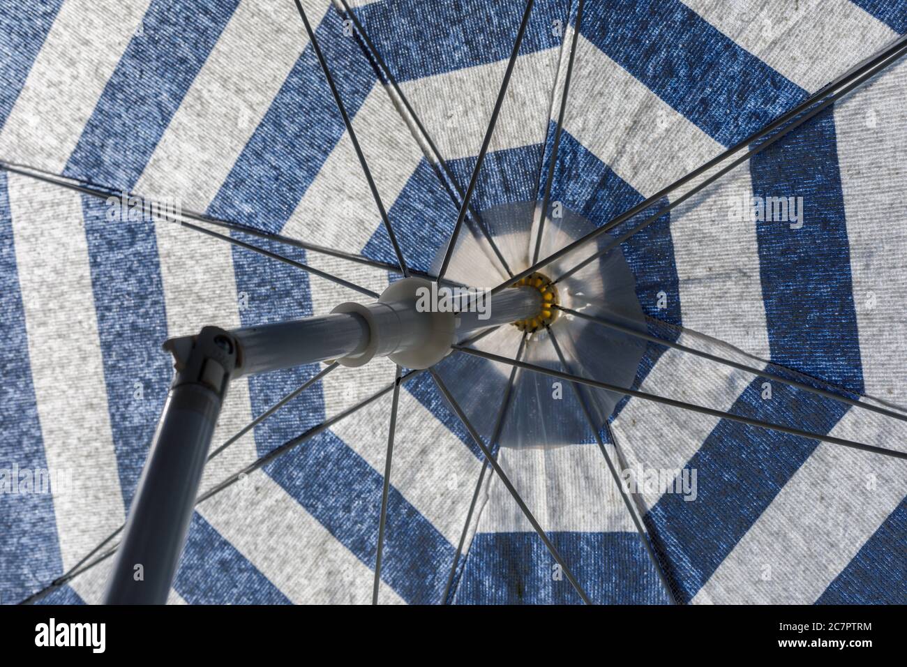Beach umbrella providing protection for sun burn Stock Photo - Alamy