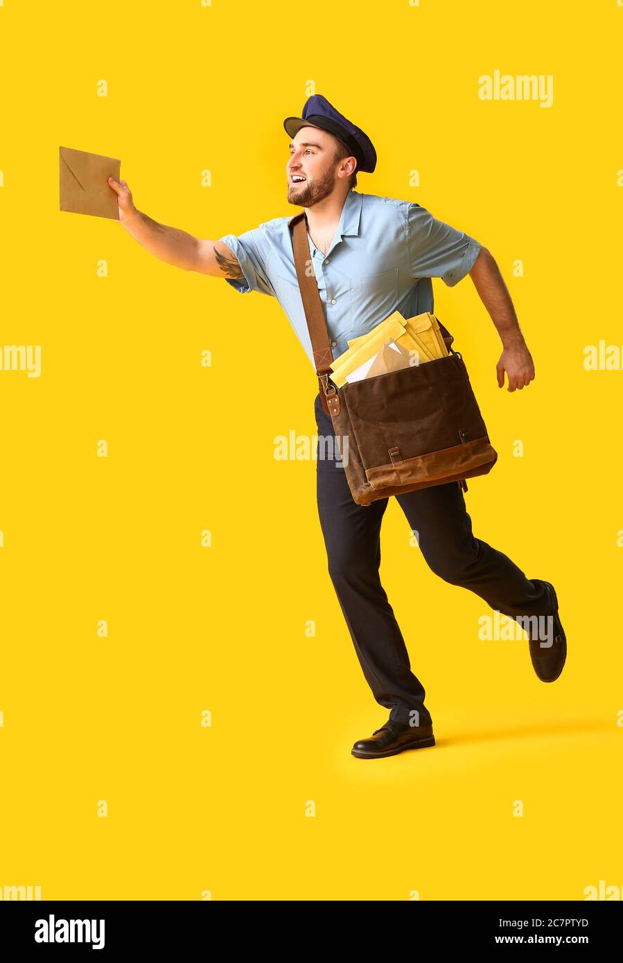 Handsome running postman on color background Stock Photo - Alamy