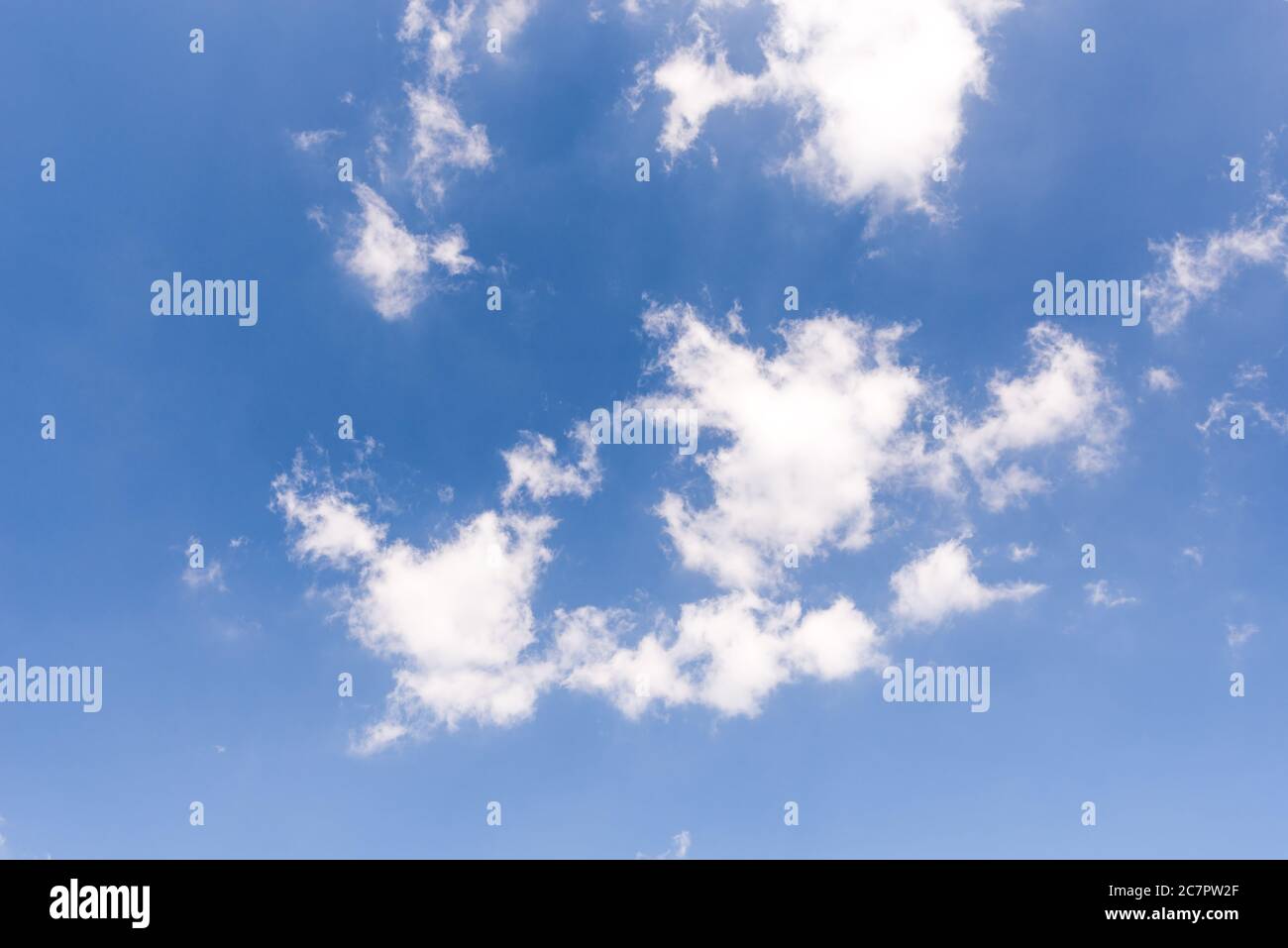 Blue spring sky background with white clouds Stock Photo - Alamy