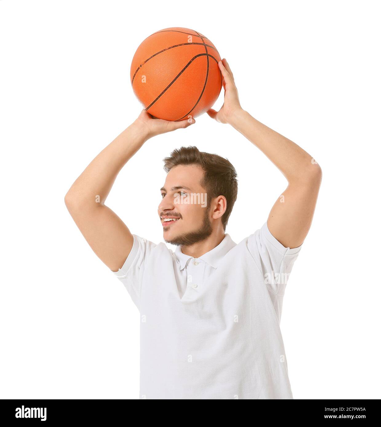 Sporty young man with ball on white background Stock Photo - Alamy