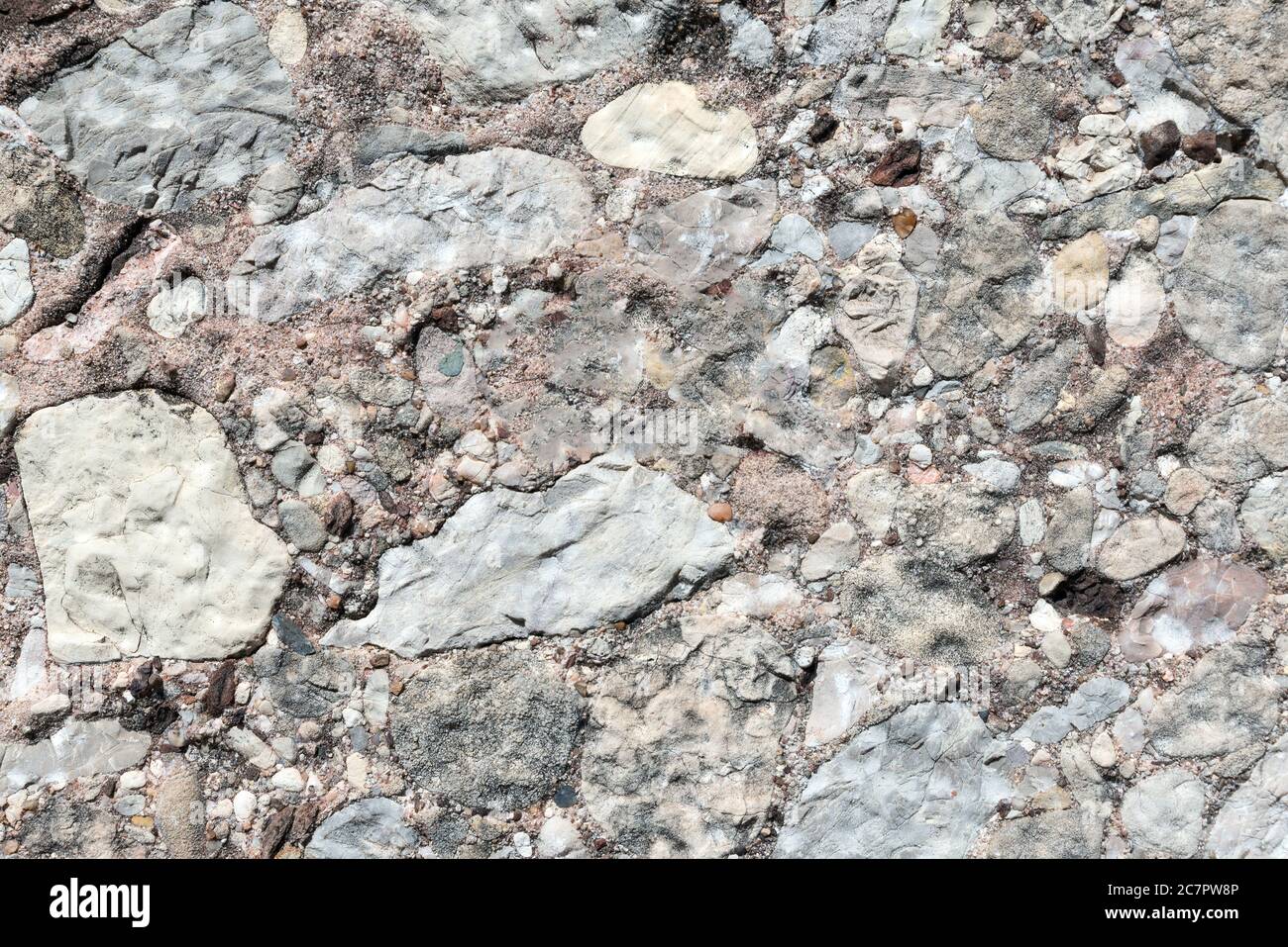 background of an old stone wall made of small stones Stock Photo - Alamy