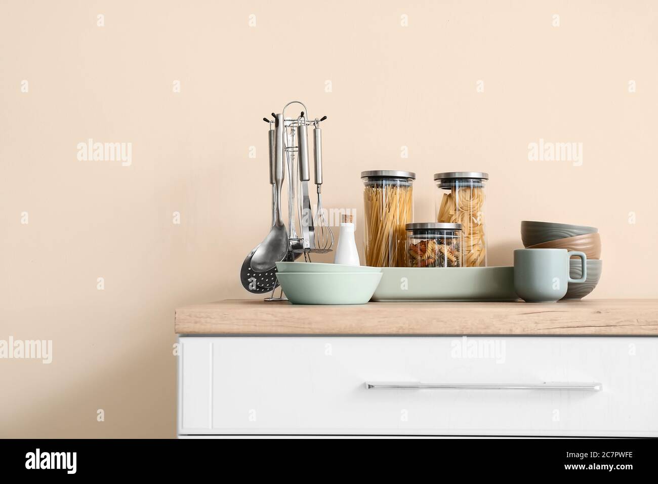 Set of utensils on kitchen counter Stock Photo - Alamy