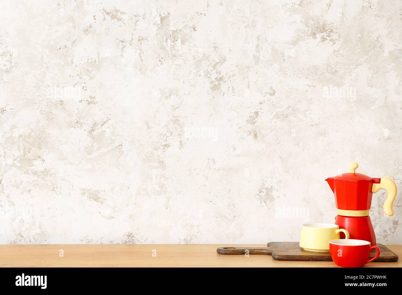 Coffee pot and cups on kitchen counter Stock Photo - Alamy