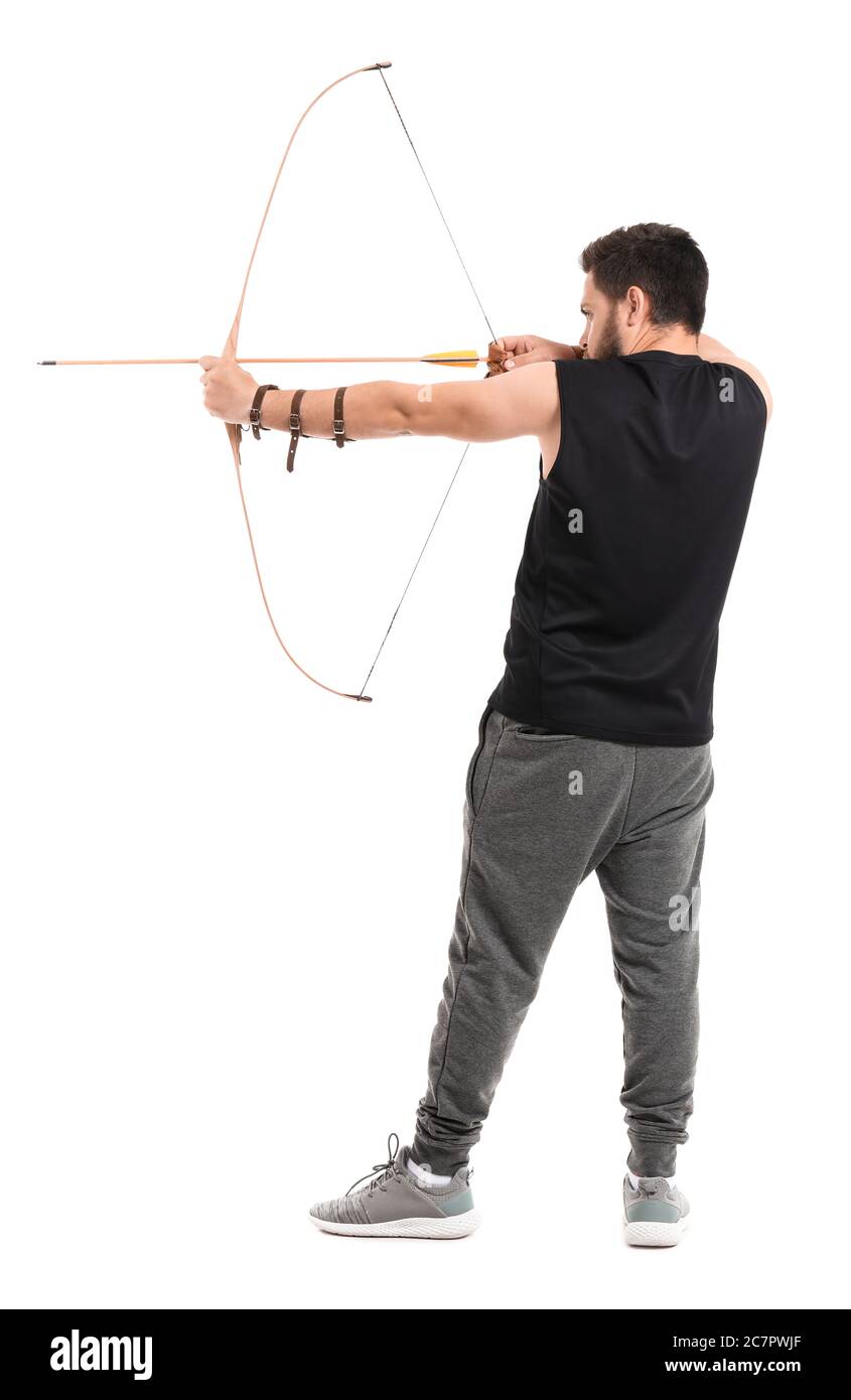 Handsome man with crossbow on white background Stock Photo - Alamy