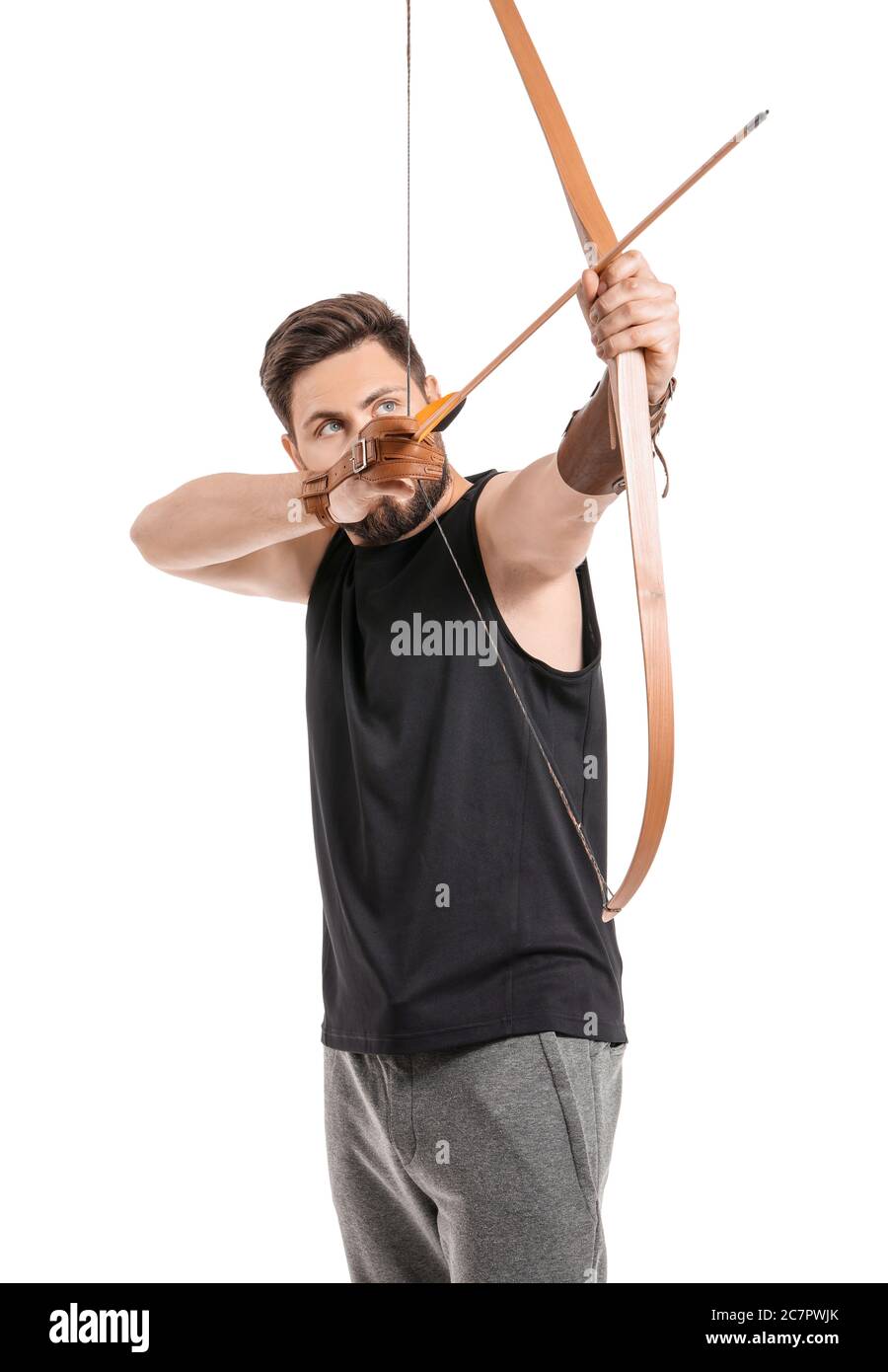 Handsome man with crossbow on white background Stock Photo - Alamy