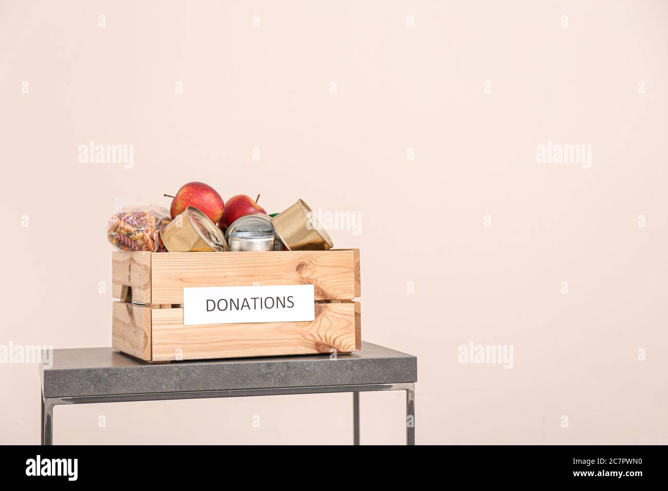Box with donations on table Stock Photo - Alamy