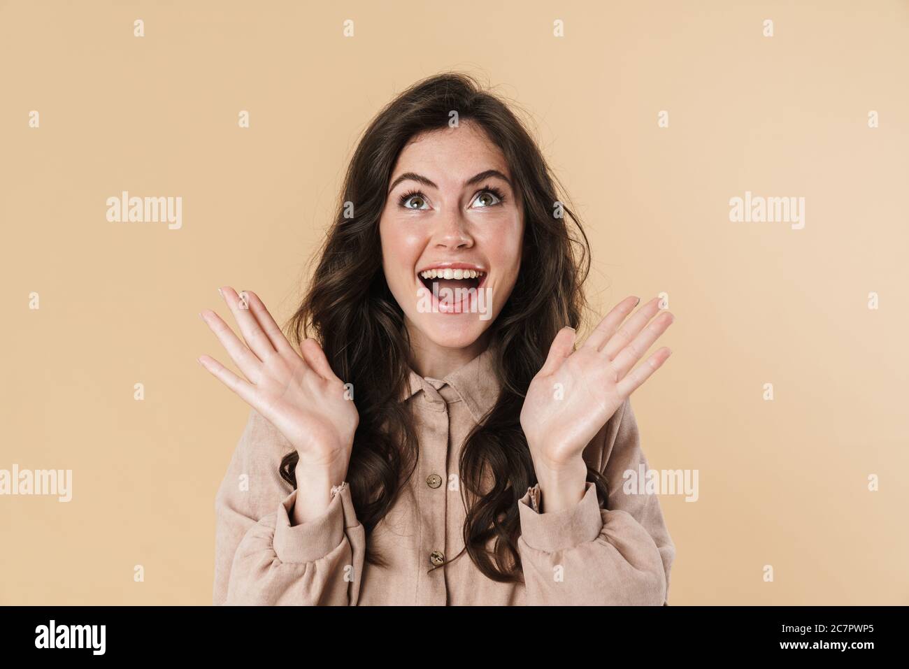Image of delighted attractive woman expressing surprise on camera ...