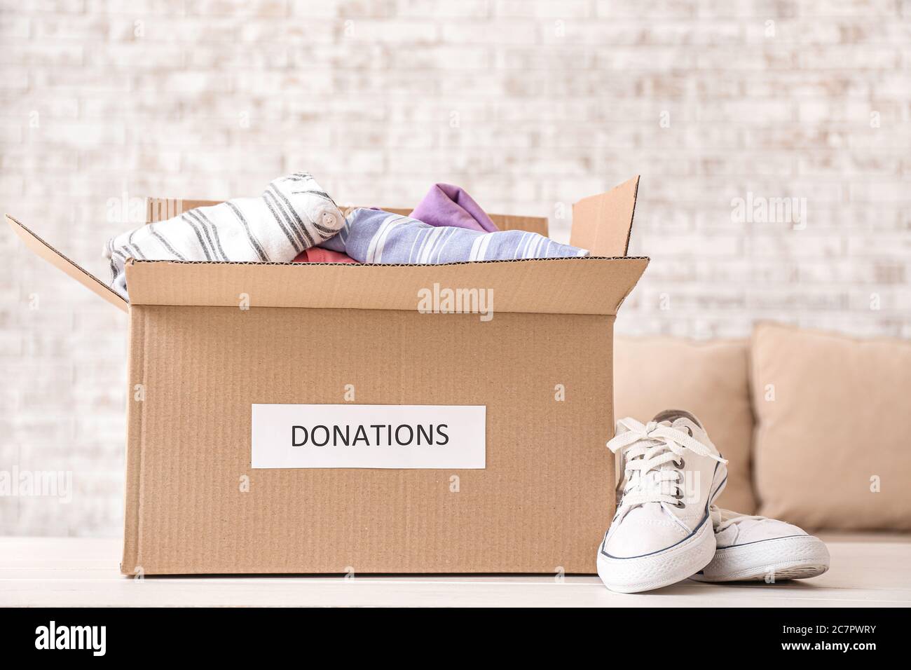 Box with donations on table Stock Photo - Alamy