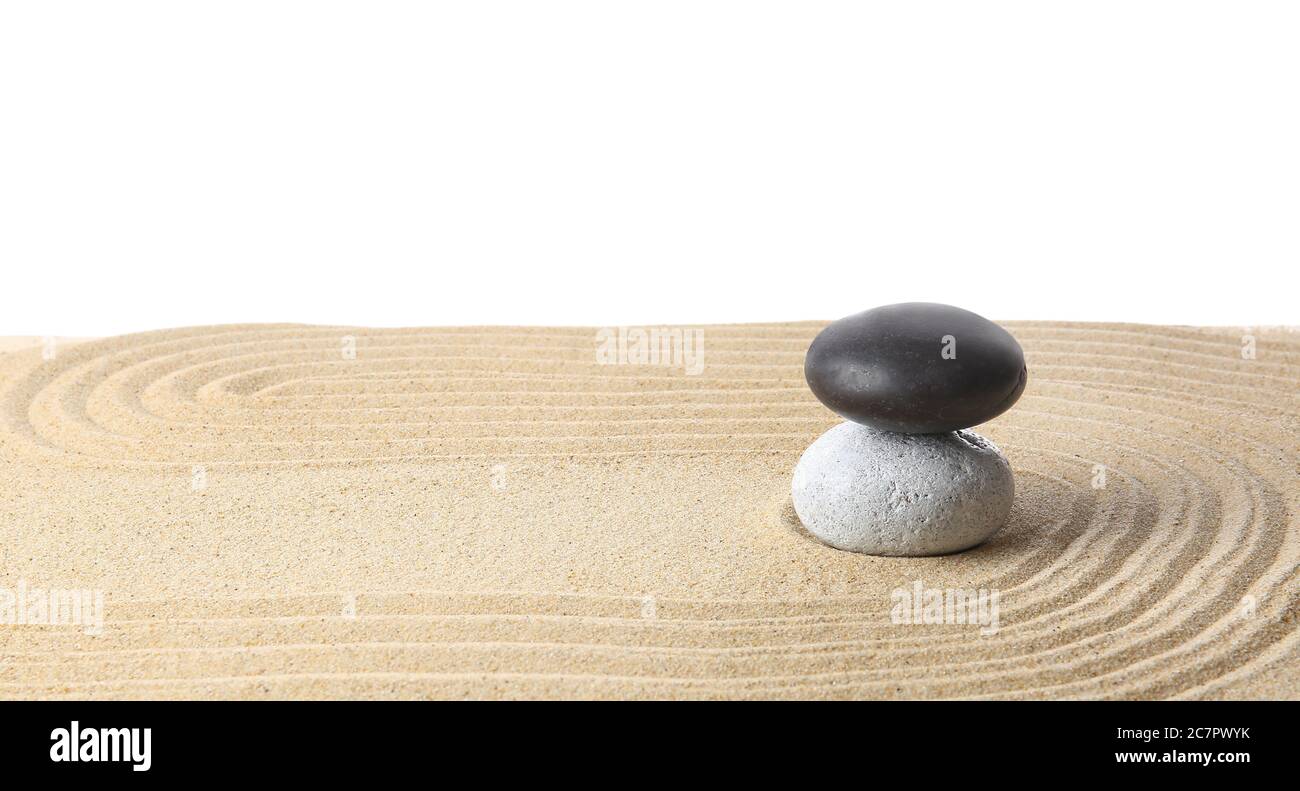 Stones on sand with lines against white background. Zen concept Stock ...