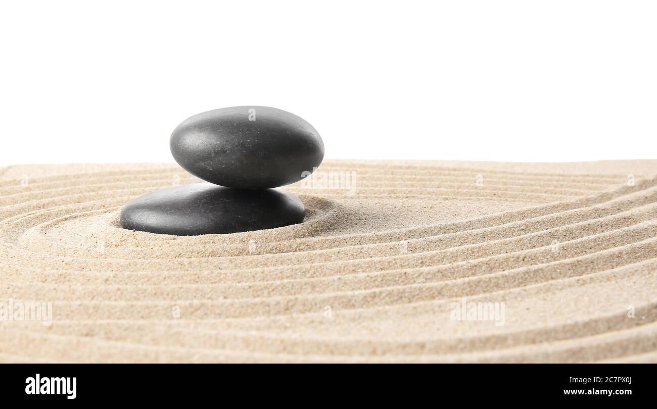 Stones on sand with lines against white background. Zen concept Stock ...