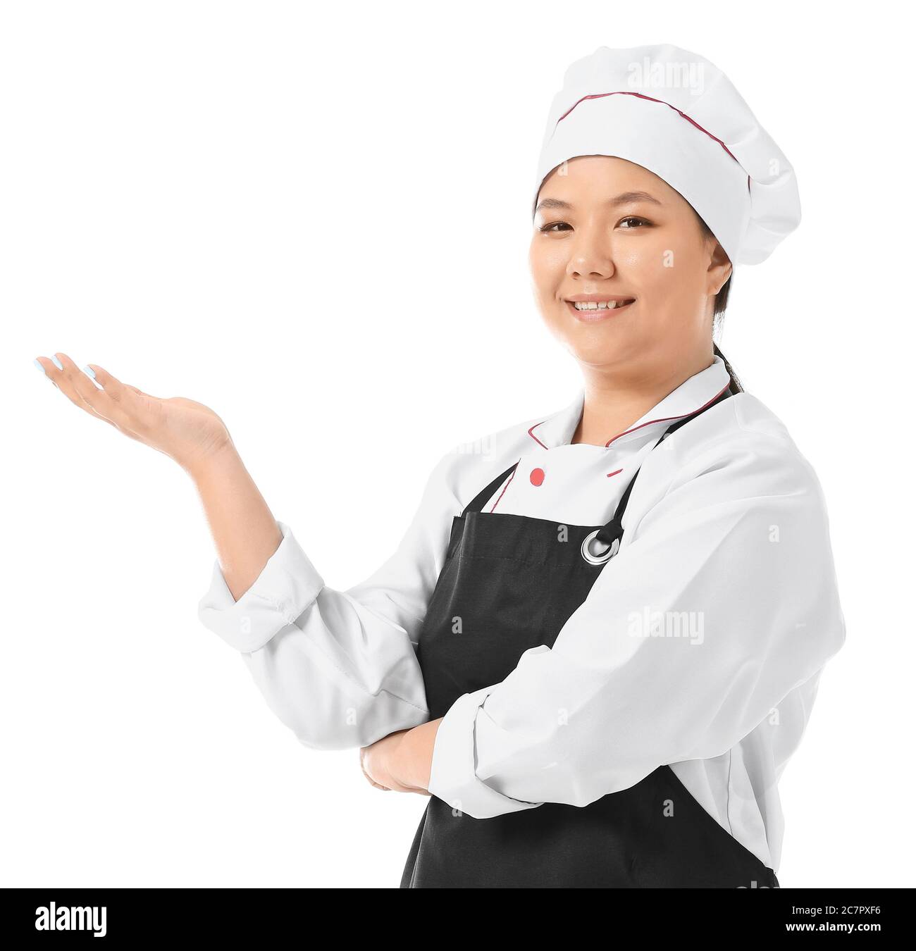 Beautiful Asian chef showing something on white background Stock Photo ...