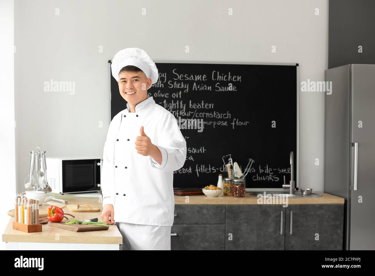 Handsome asian chef cooking hi-res stock photography and images - Alamy