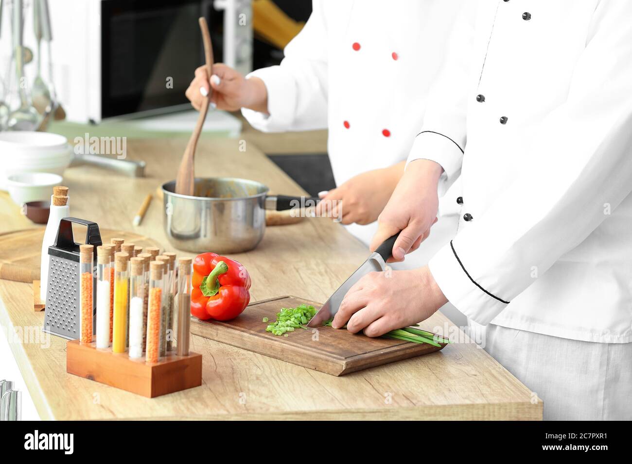 Asian chefs cooking together in kitchen Stock Photo - Alamy