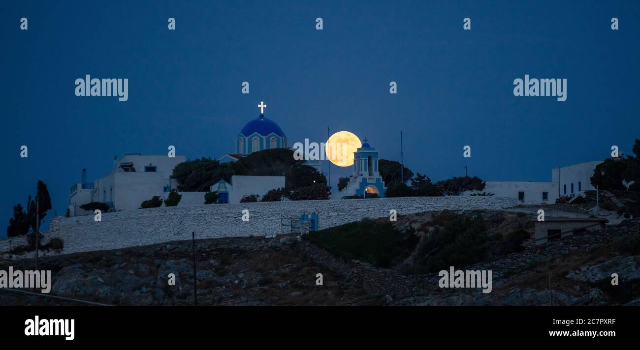 Full moon on dark blue sky above Kastriani monastery. Greece. Kea ...
