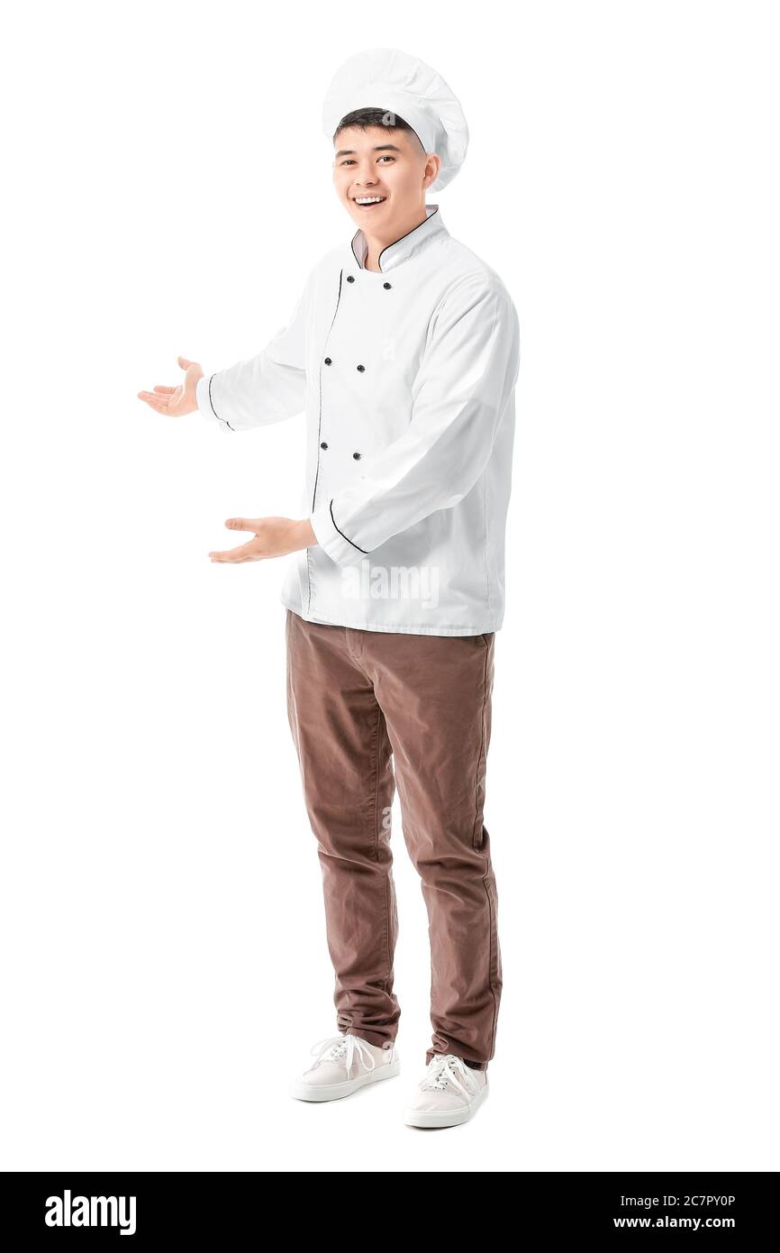 Handsome Asian chef Handsome Asian chef showing something on white ...
