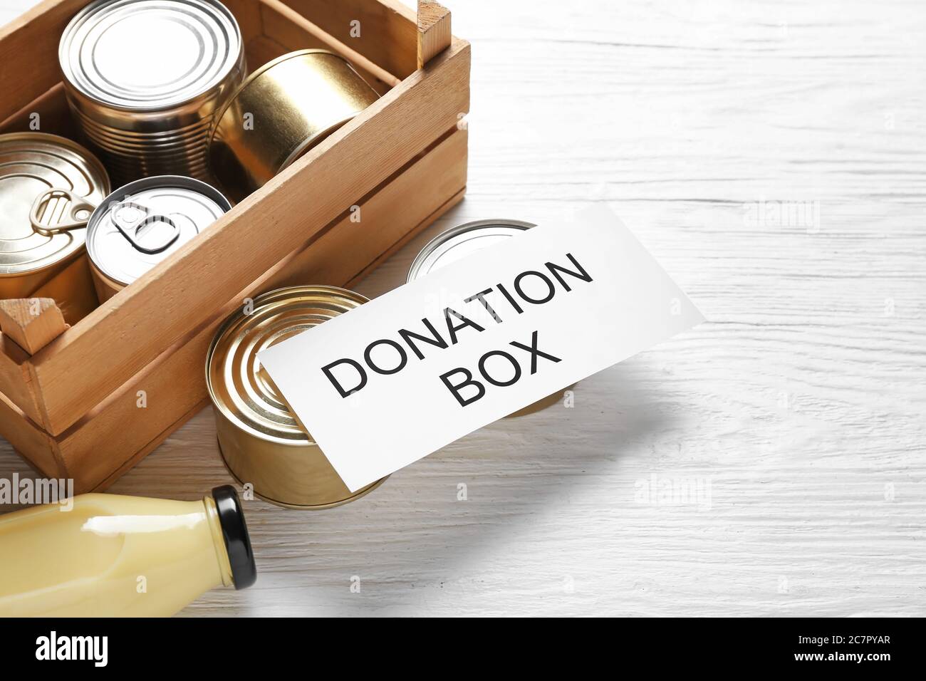 Donation box with products on white background Stock Photo - Alamy