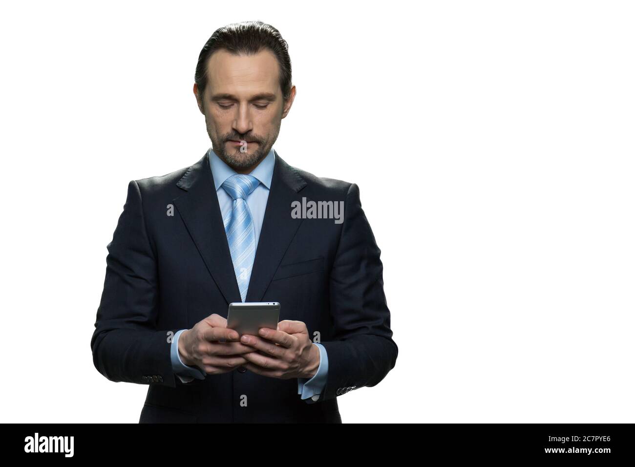 Handsome businessman checking the phone Stock Photo - Alamy