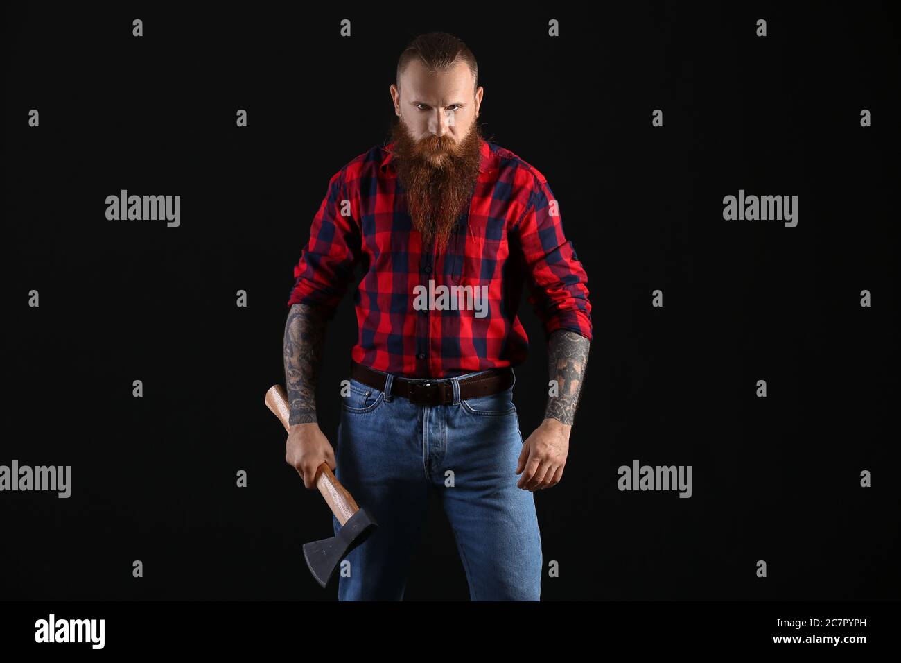 Handsome lumberjack on dark background Stock Photo - Alamy