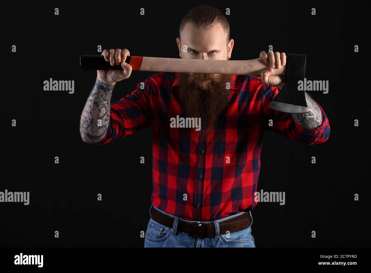 Handsome lumberjack on dark background Stock Photo - Alamy