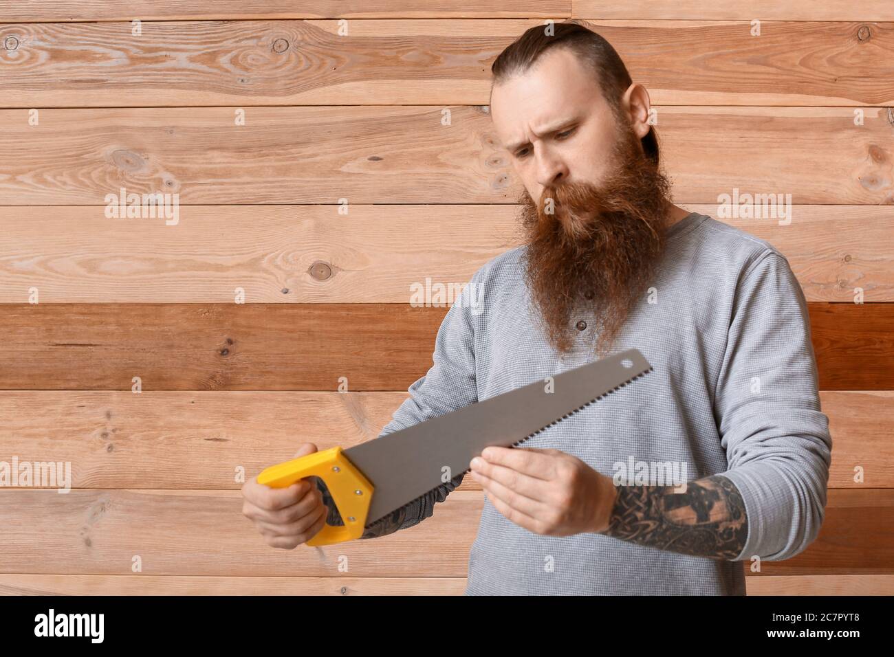 Handsome lumberjack on wooden background Stock Photo - Alamy