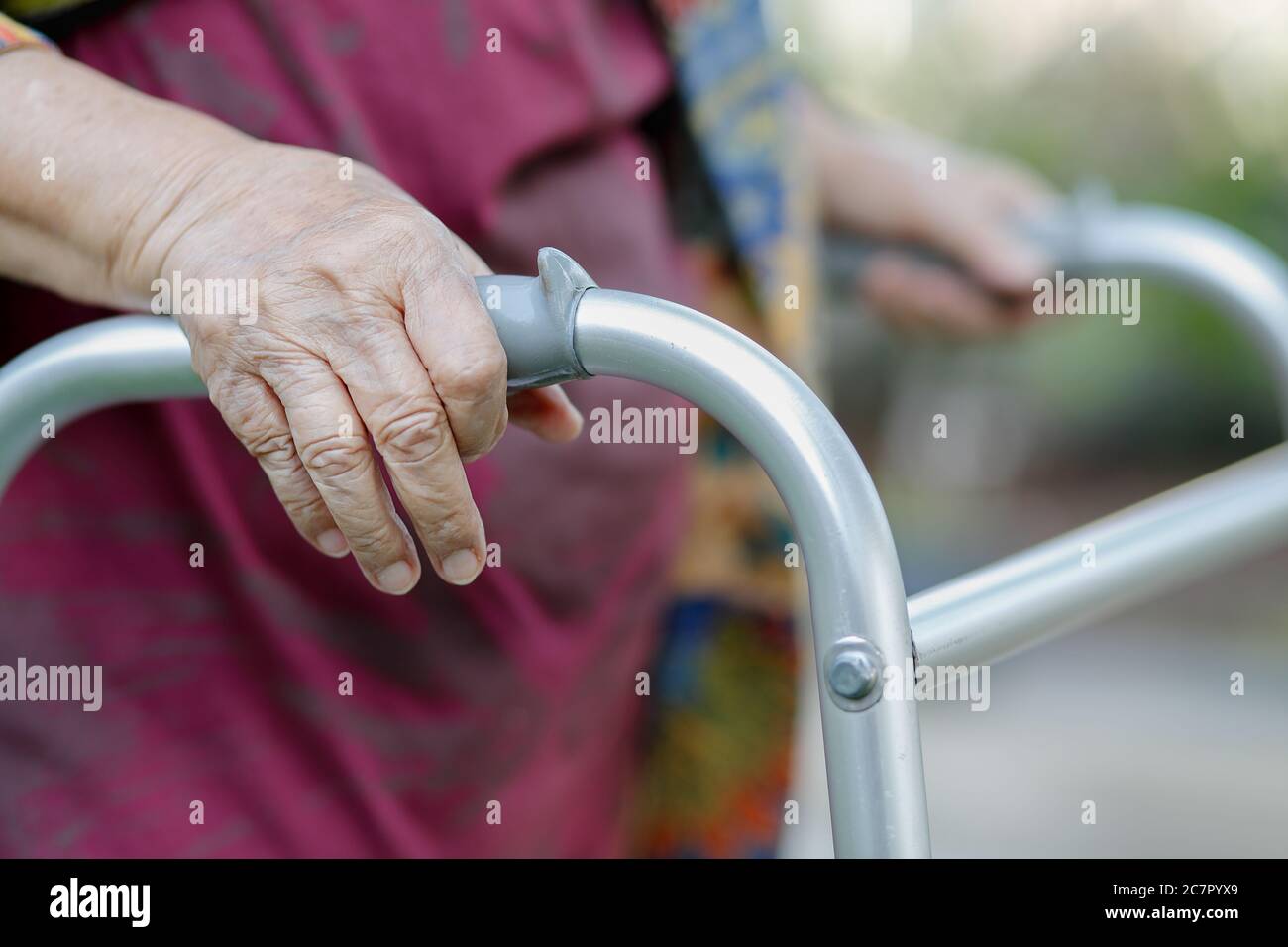 Woman walking walker in hospital hi-res stock photography and images ...