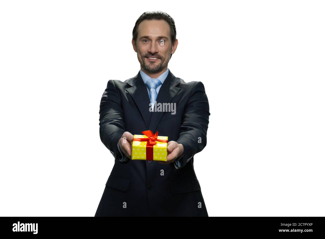 Smiling chief in costume giving a present Stock Photo - Alamy