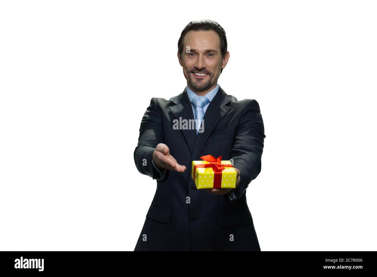 Attractive boss handing a present Stock Photo - Alamy