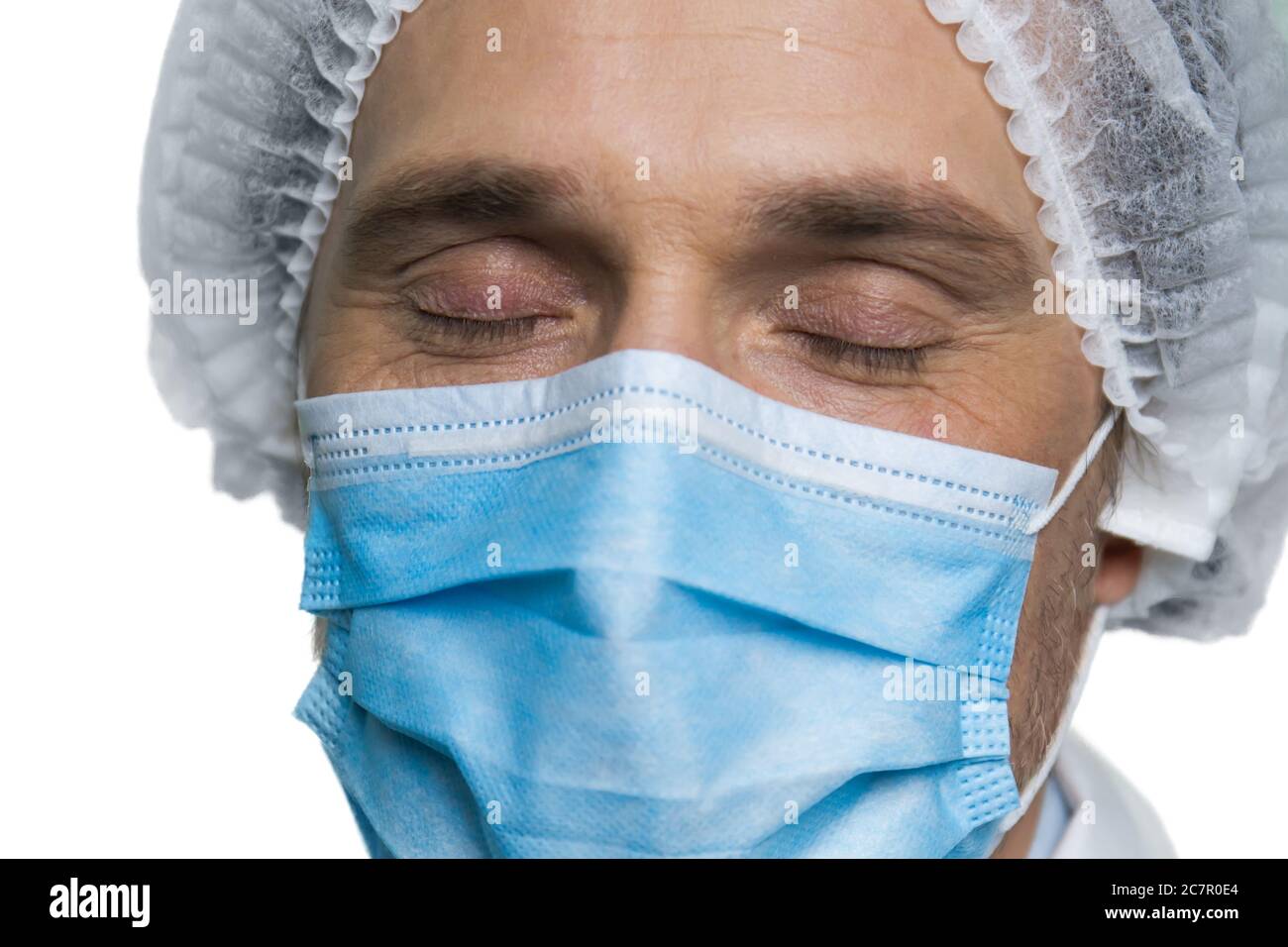Portrait of doctor's face with closing eyes Stock Photo - Alamy