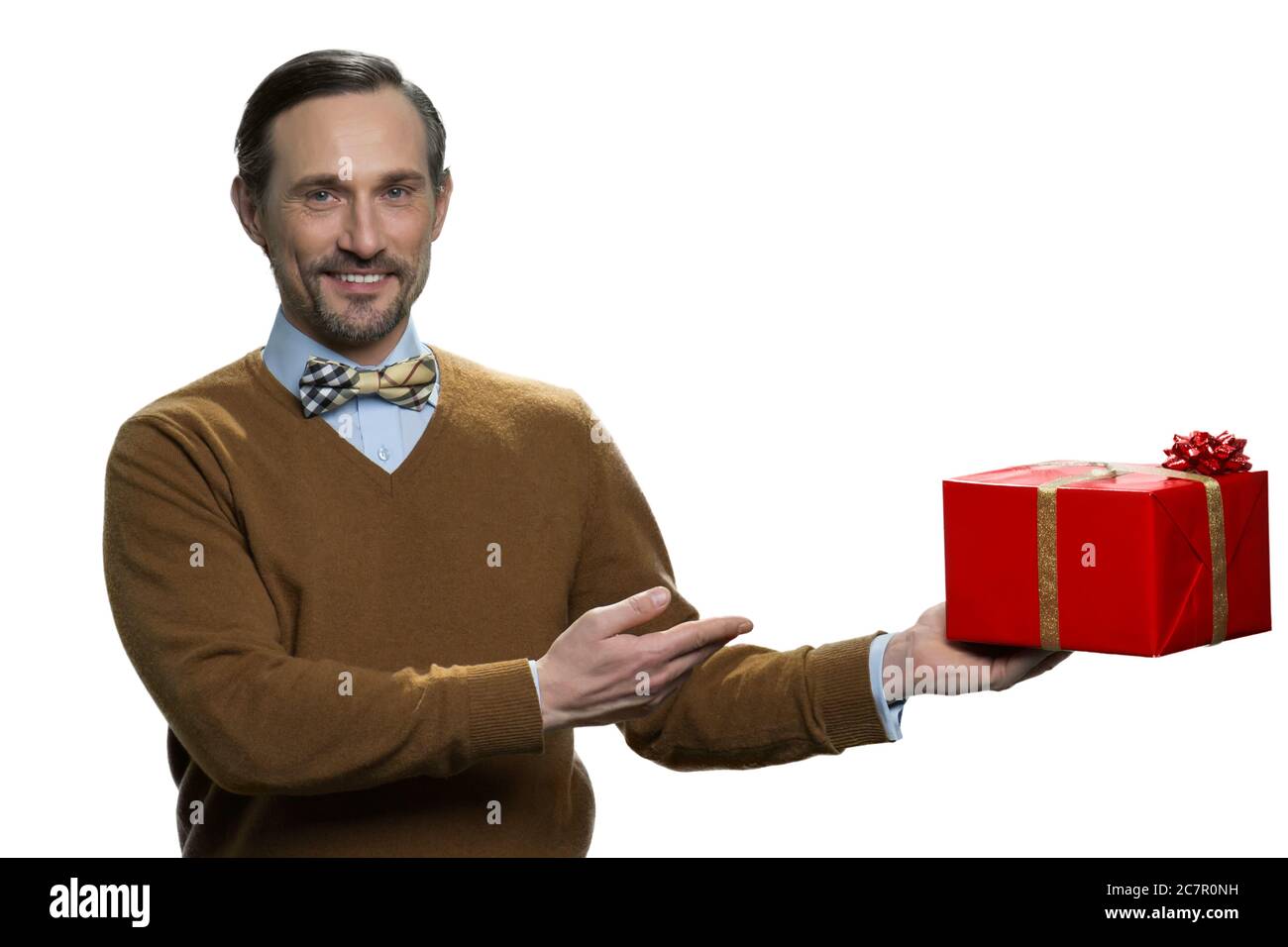 Portrait of caucasian adult man showing the present Stock Photo - Alamy