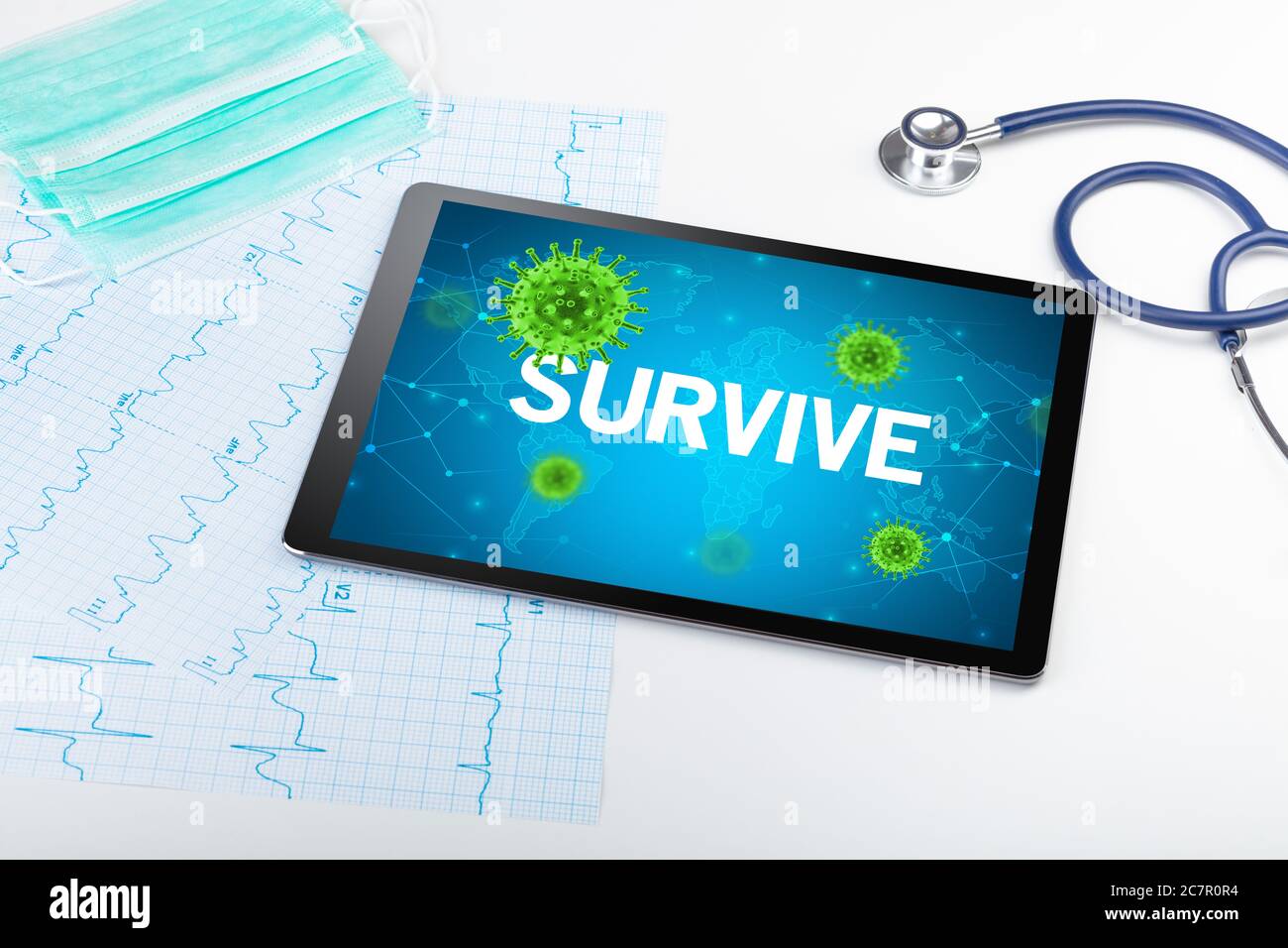 Close-up view of a tablet pc with SURVIVE inscription, microbiology ...