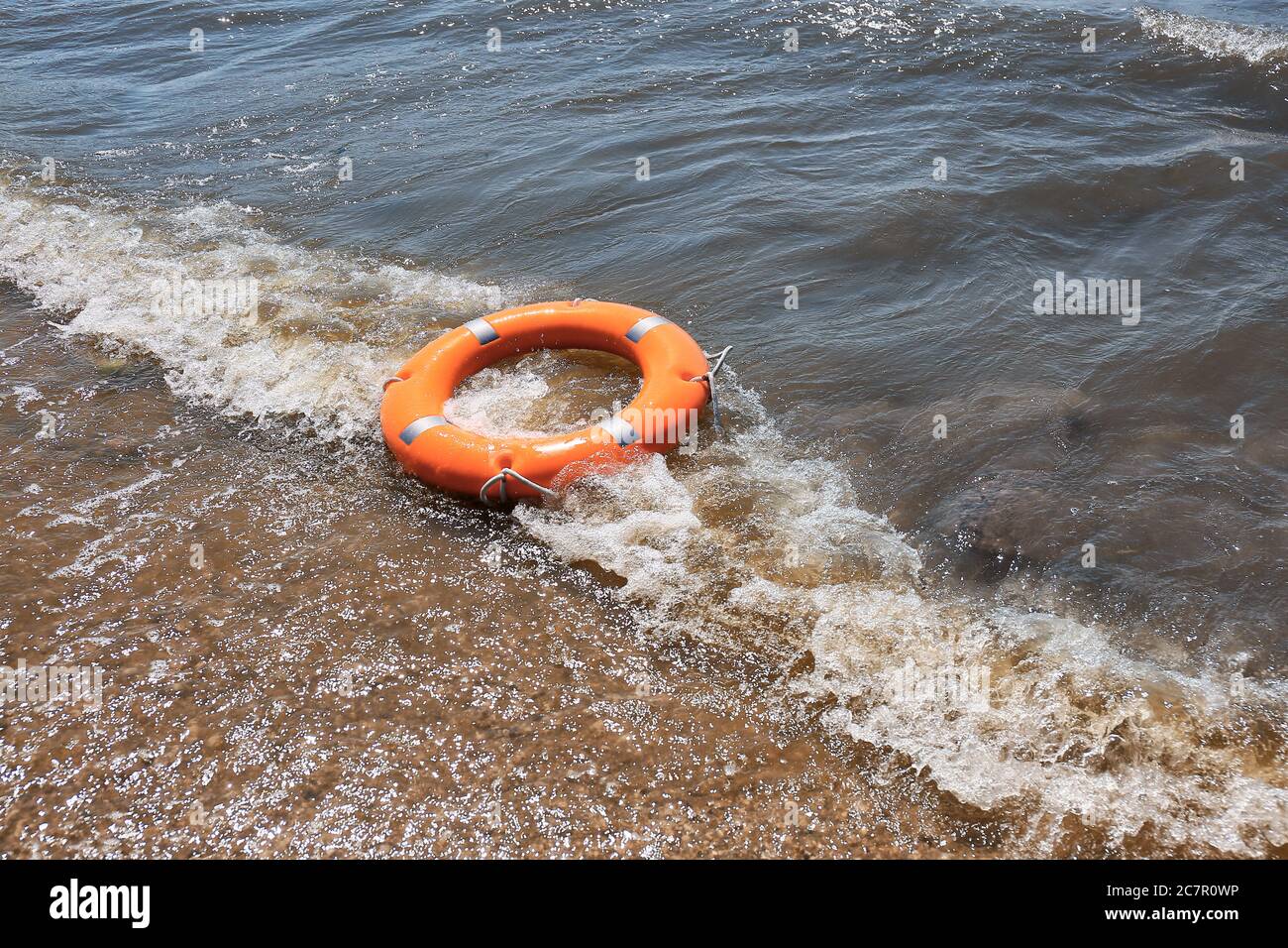 Lifebuoy ring floating on water Stock Photo - Alamy