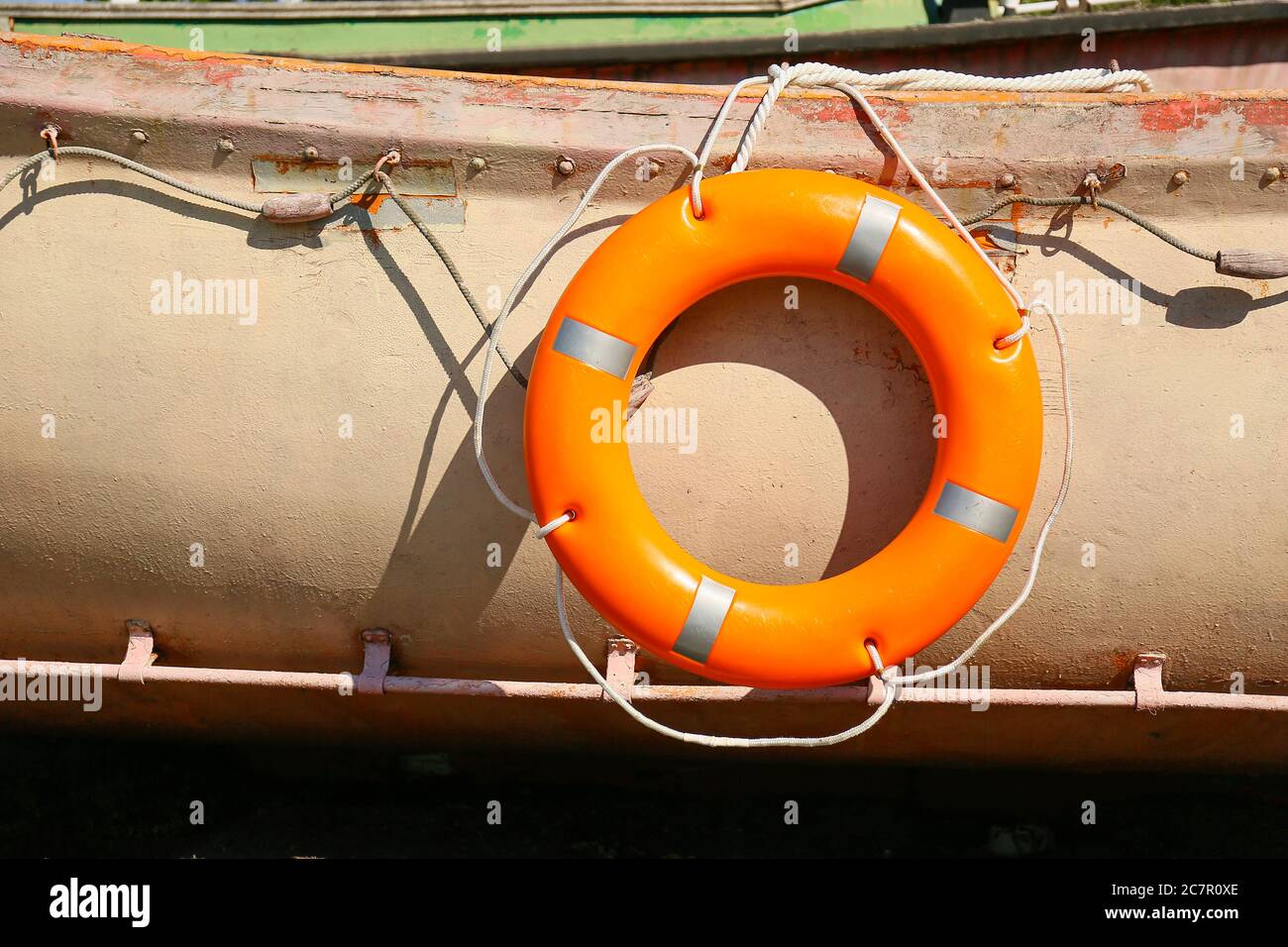 Boat with lifebuoy ring on berth Stock Photo - Alamy