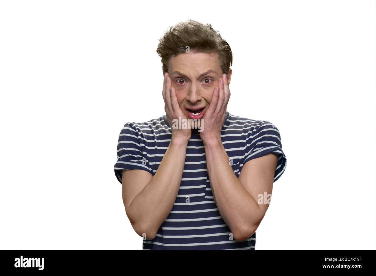 Hateful shocked crying teen guy is touching his face Stock Photo - Alamy