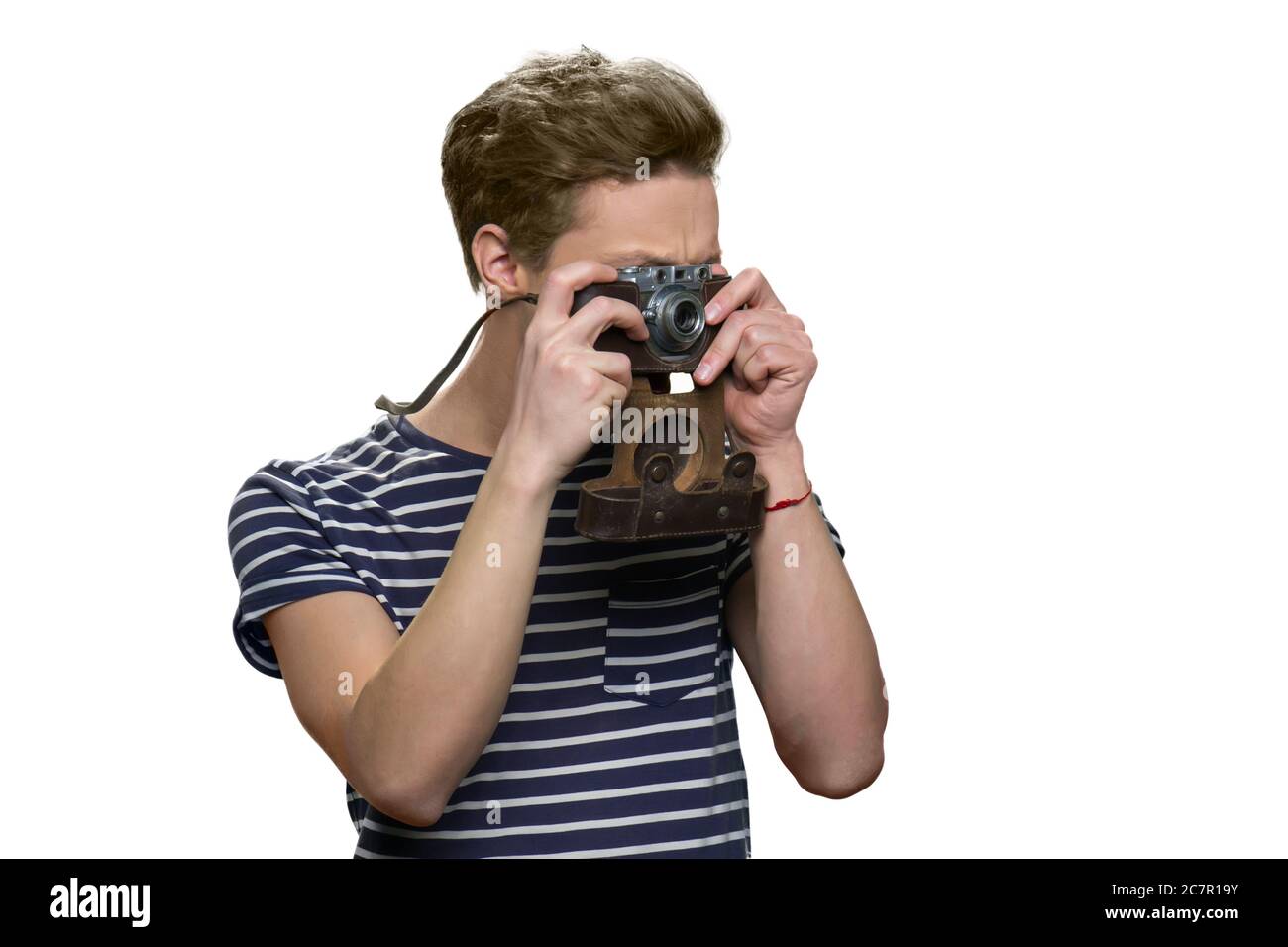 Boy taking a photo using retro vintage photo camera Stock Photo - Alamy
