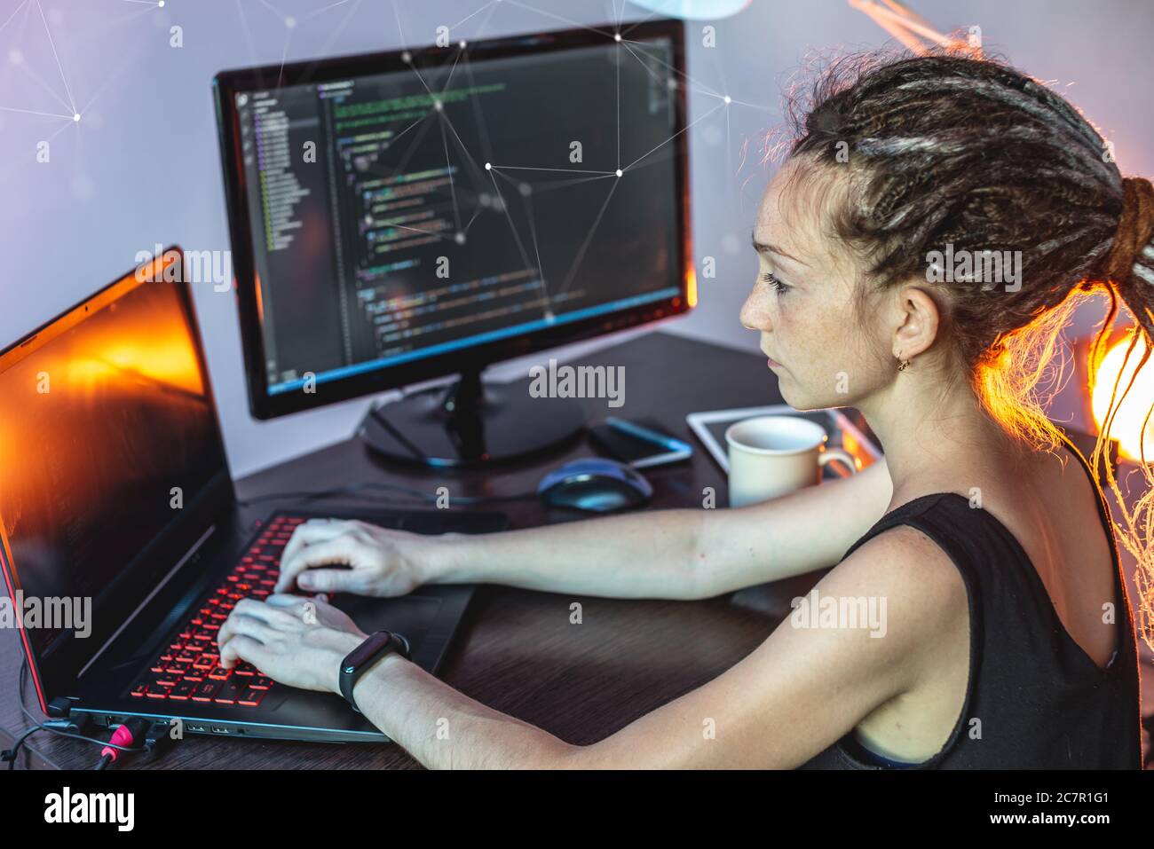 Modern Young Female Programmer Is Writing Program Code On A Laptop At