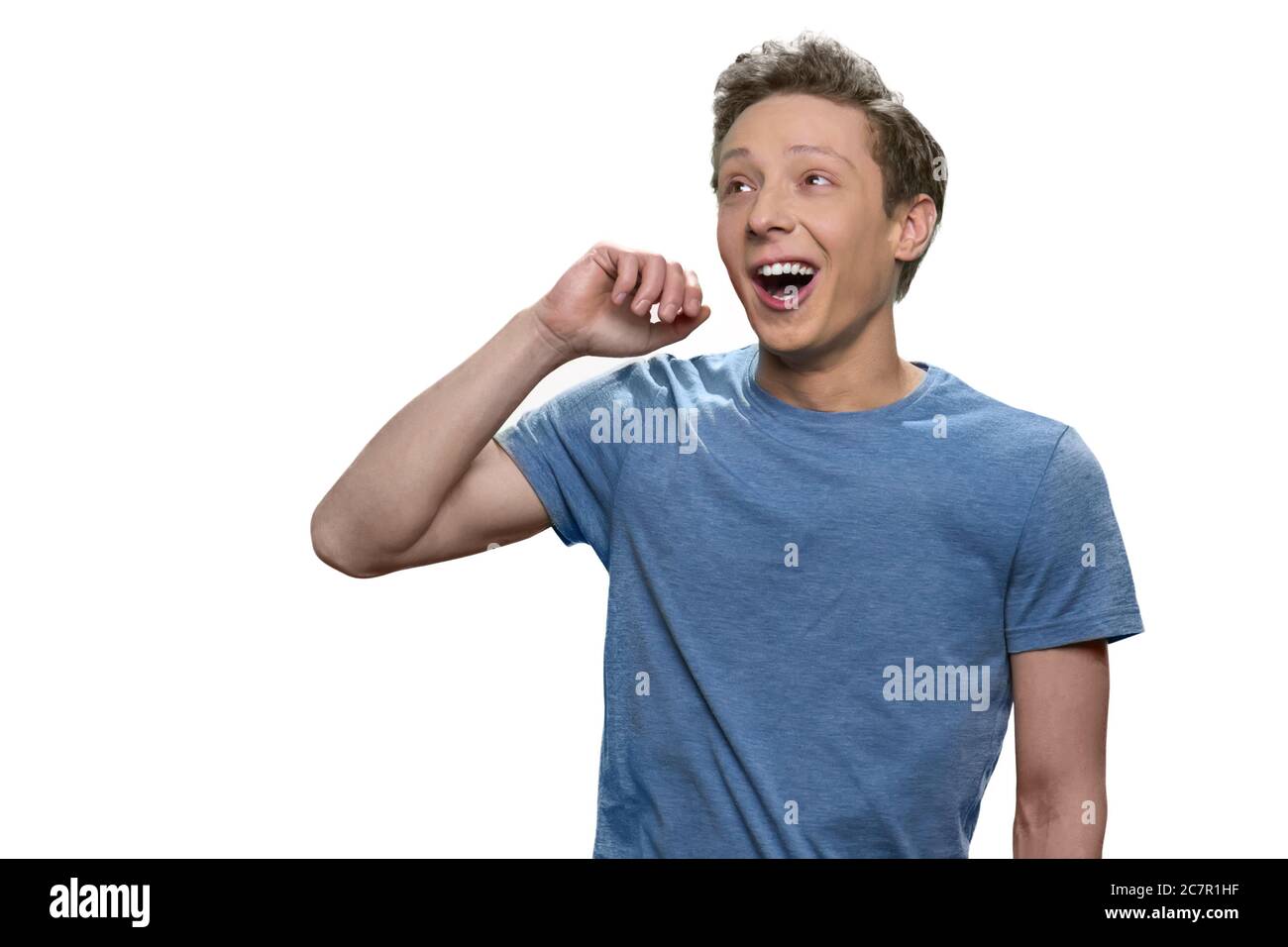Yawning teen boy isolated on white background Stock Photo - Alamy