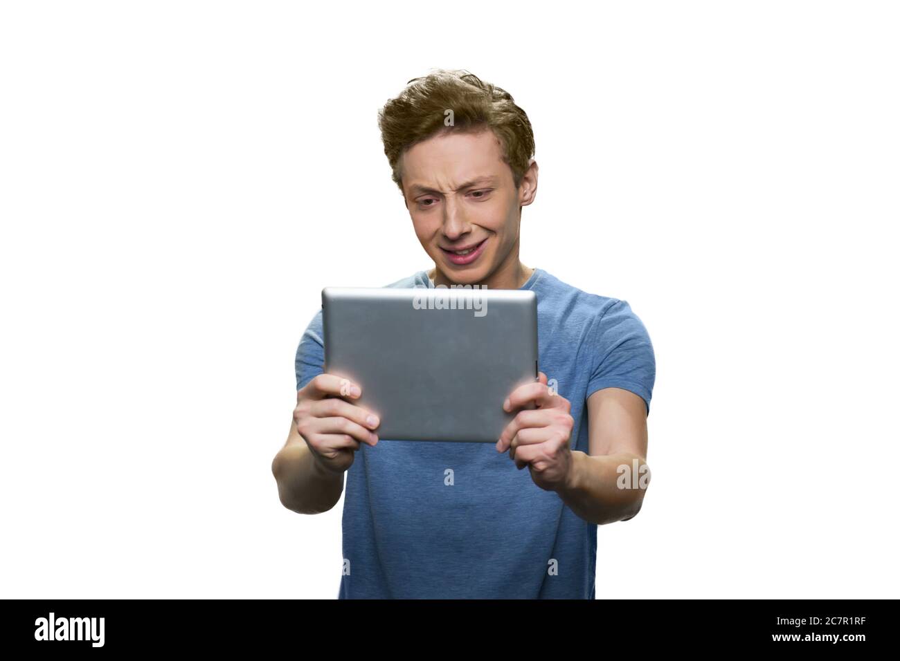 Teen skinny guy is holding tablet pc Stock Photo - Alamy