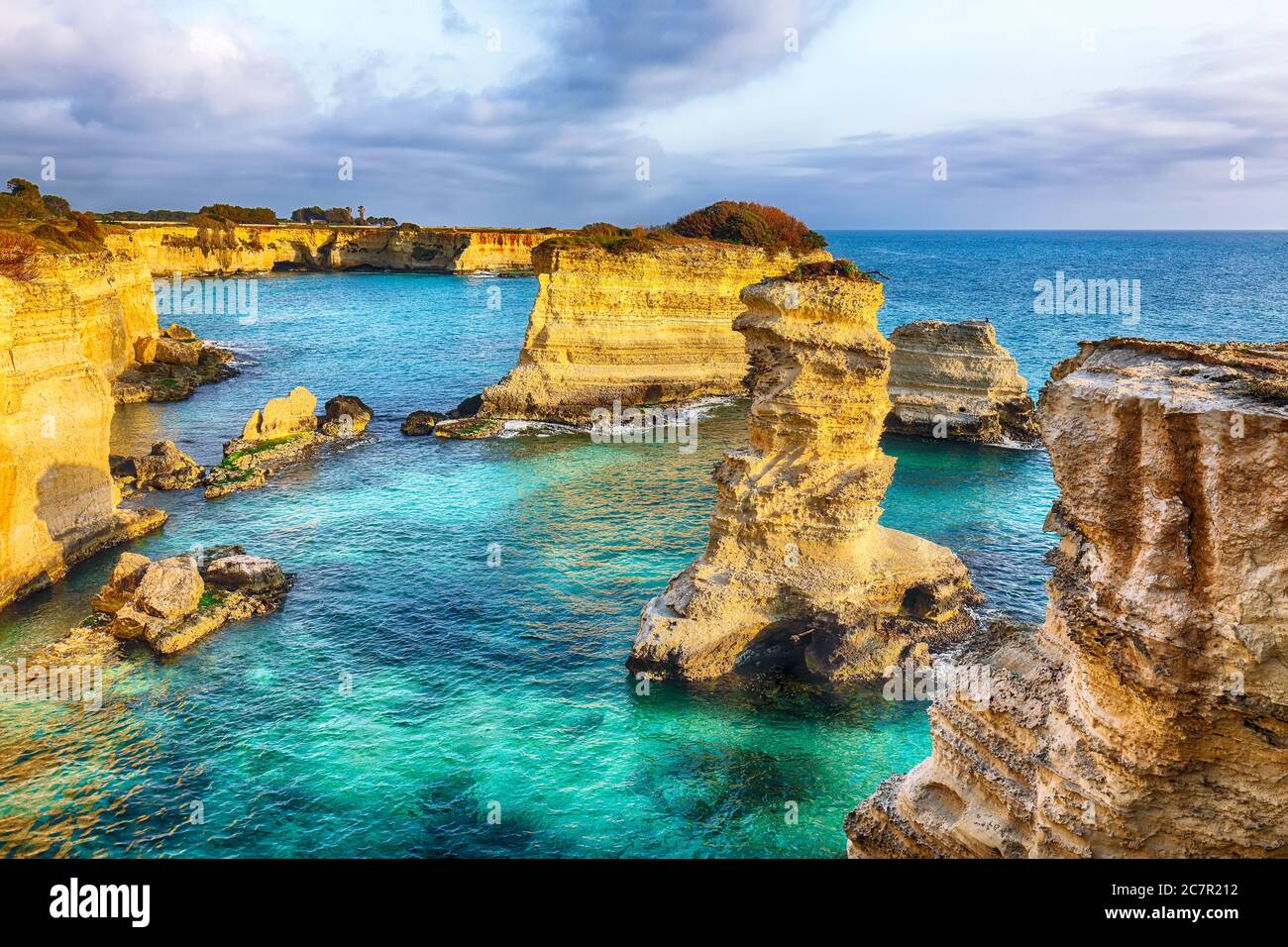 Dramatic seascape with cliffs, rocky arch at Torre Sant Andrea, Salento ...