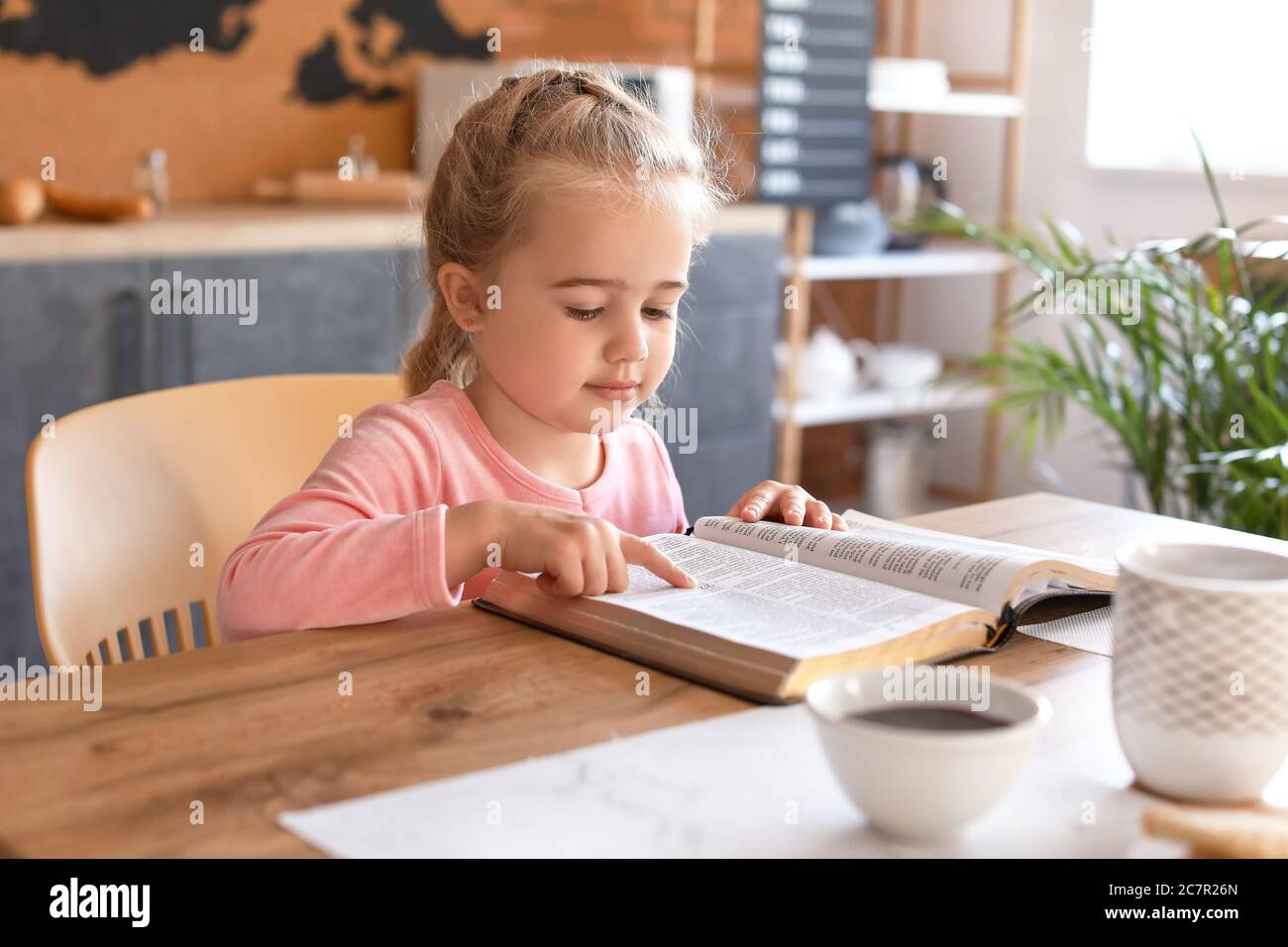 Girl reading bible hi-res stock photography and images - Alamy