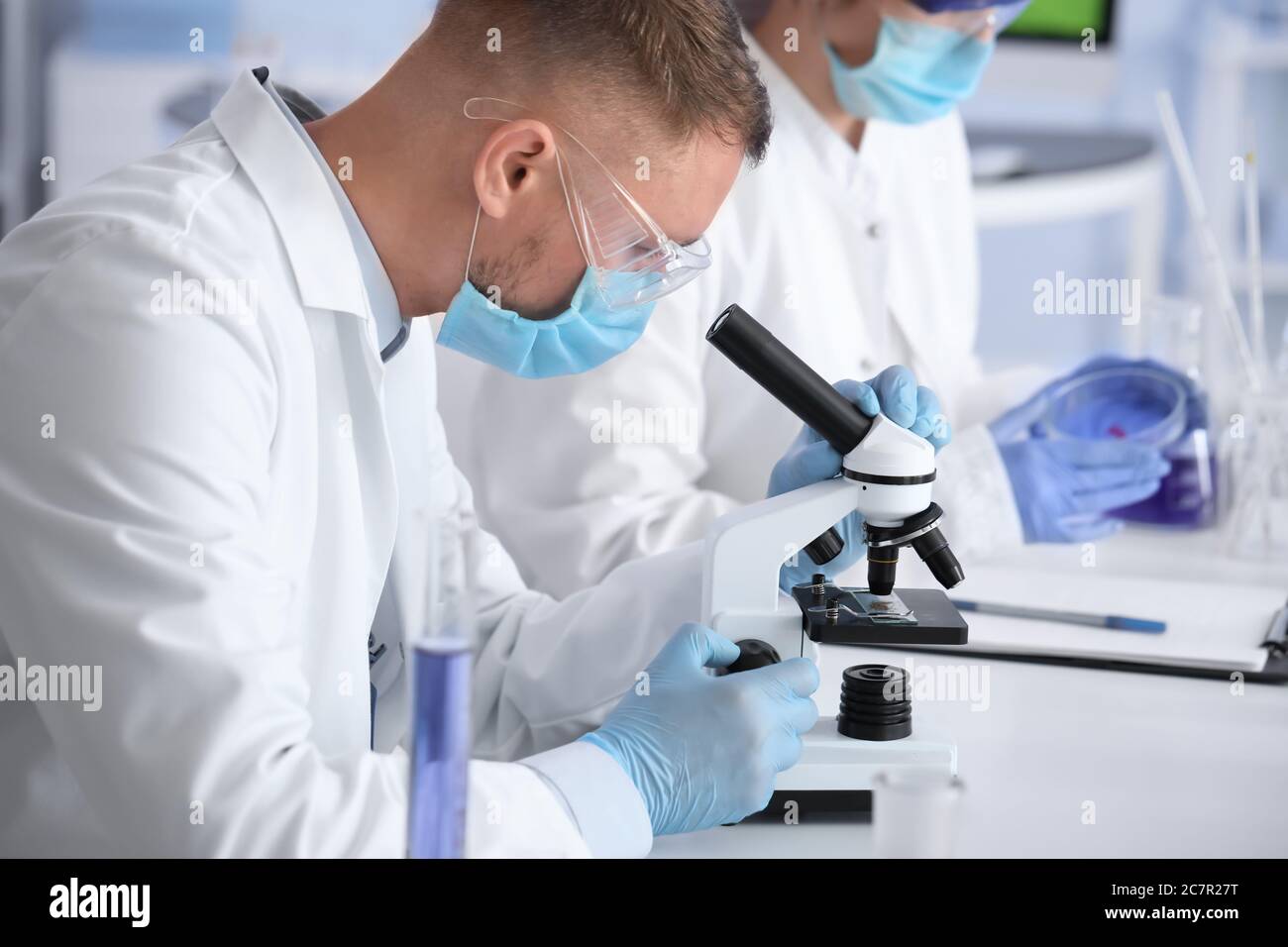 Scientists working with samples in laboratory Stock Photo - Alamy