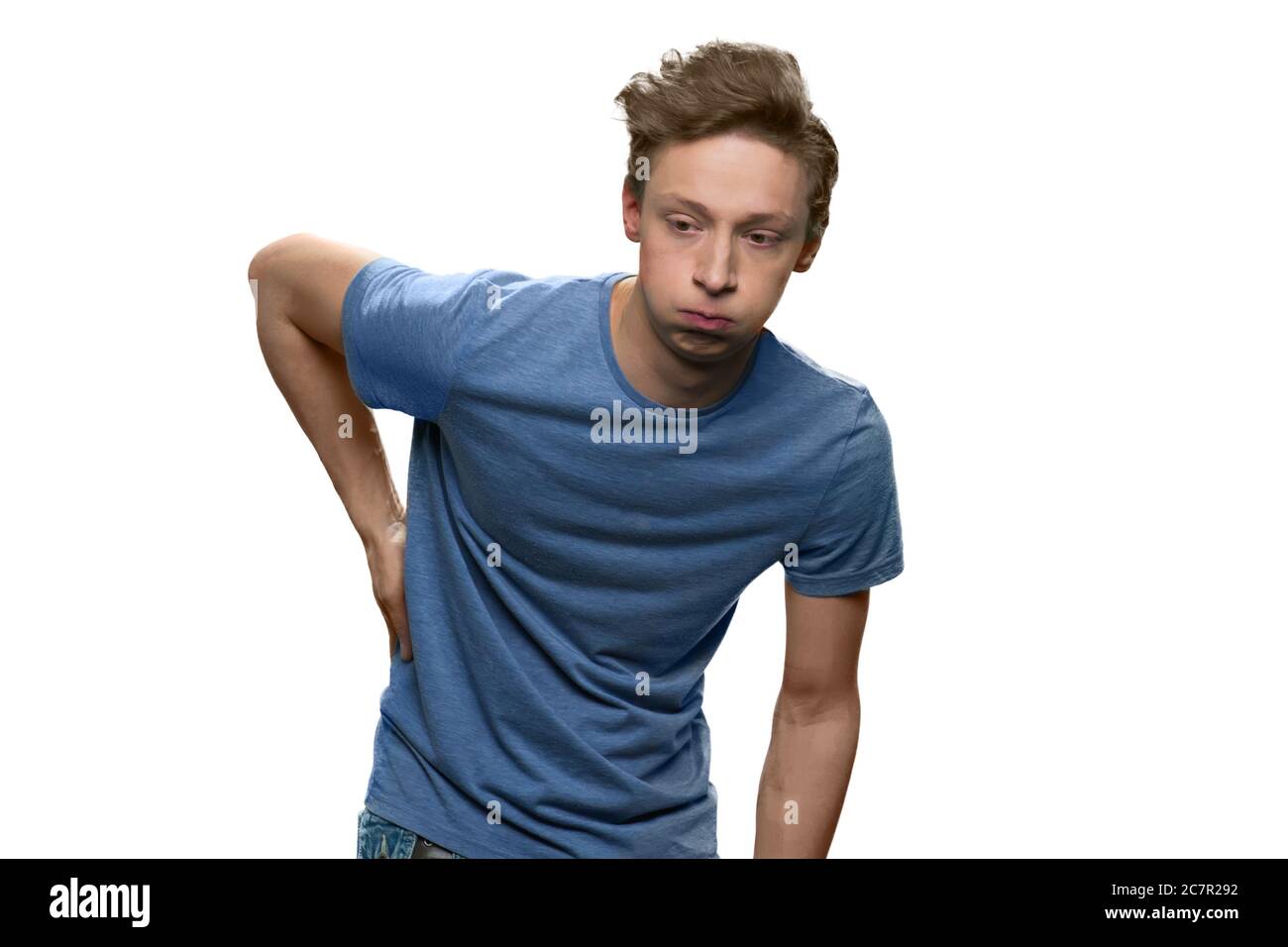 Teenager boy with back pain Stock Photo - Alamy