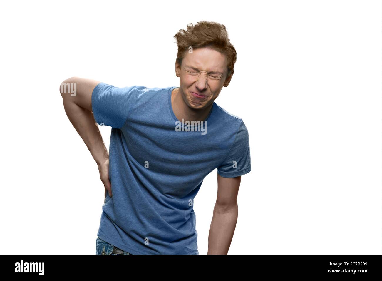 Portrait of teenage boy's suffering from backache Stock Photo - Alamy
