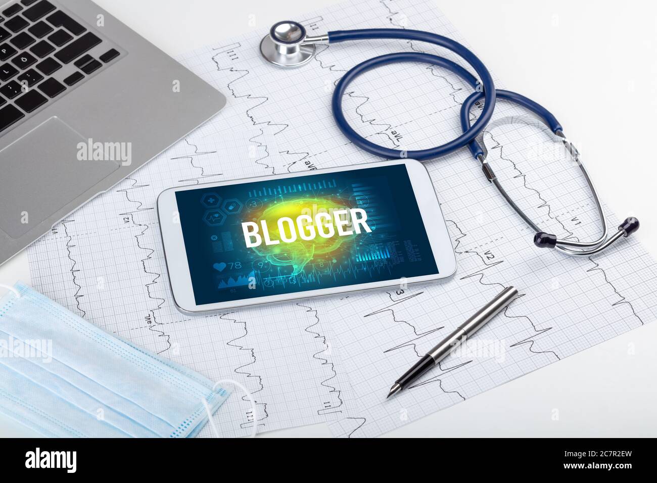 Tablet pc and medical tools with BLOGGER inscription, social distancing ...