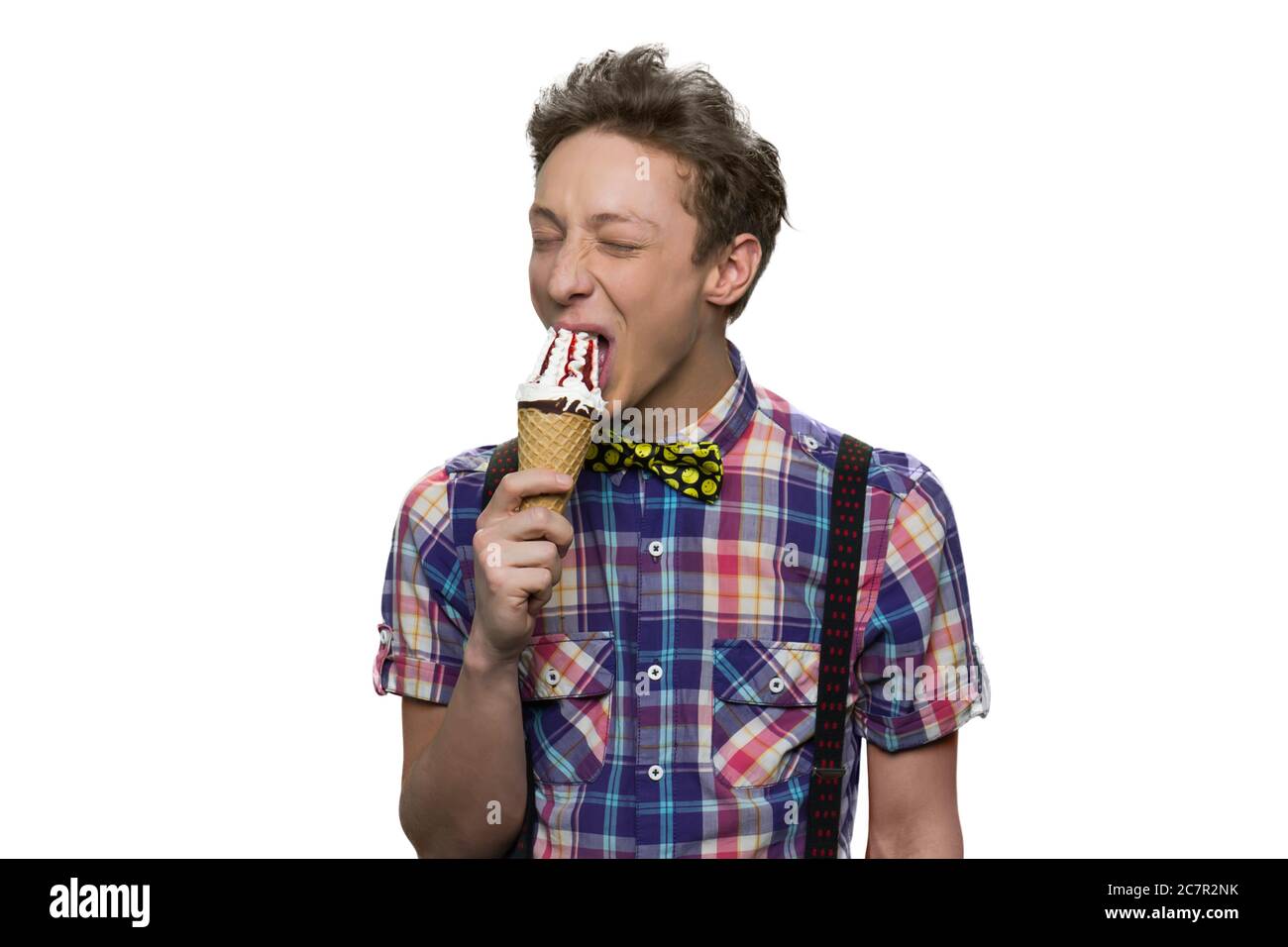Teenager boy is eating cold ice-cream Stock Photo - Alamy