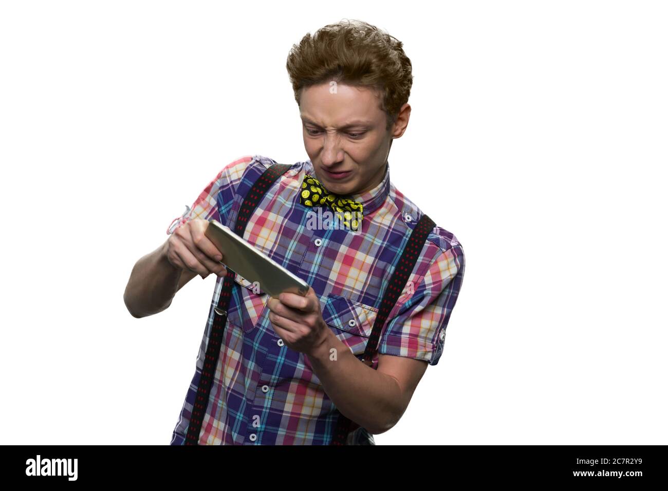 Nervous teenage gamer's playing a game on his smartphone Stock Photo ...