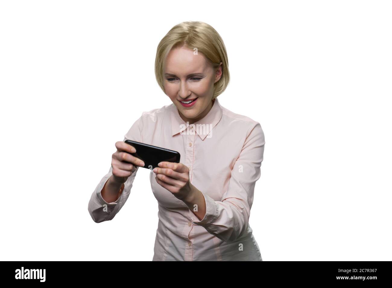 Lady playing game on phone hi-res stock photography and images - Alamy