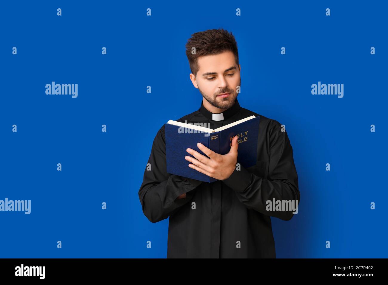 Priest reading bible hi-res stock photography and images - Alamy