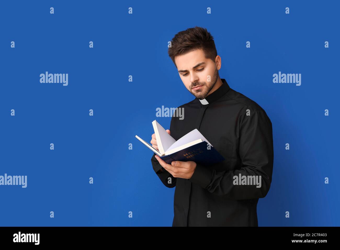 Priest reading bible hi-res stock photography and images - Alamy