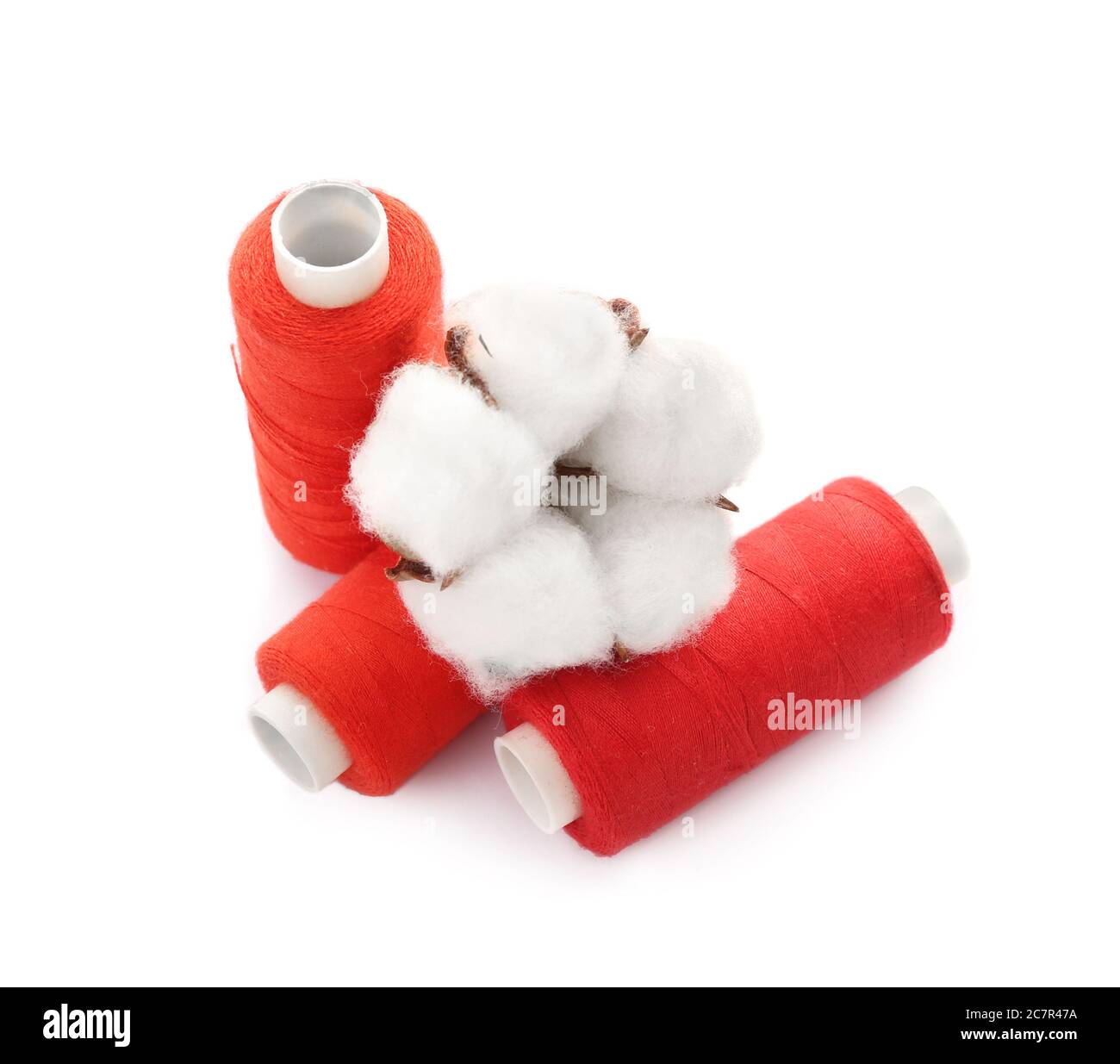 Cotton flower and threads on white background Stock Photo - Alamy